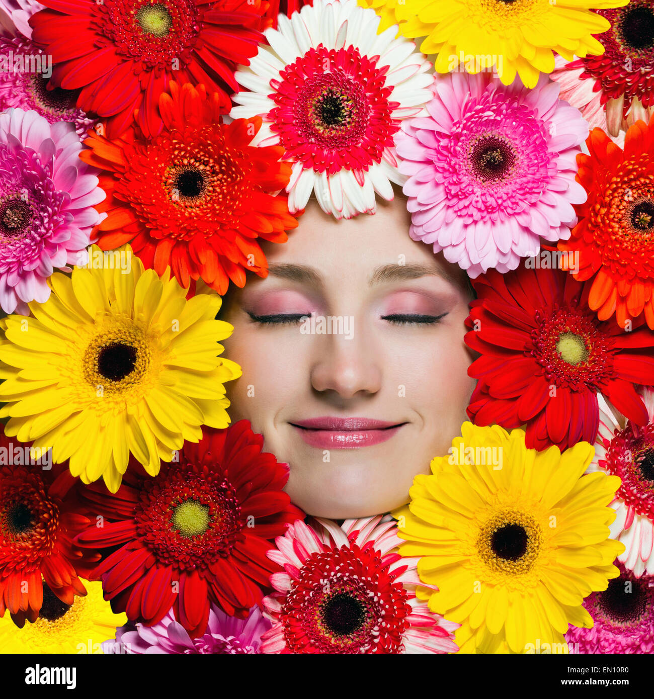 Happy beautiful girl with flowers around her face. Beauty woman Stock ...