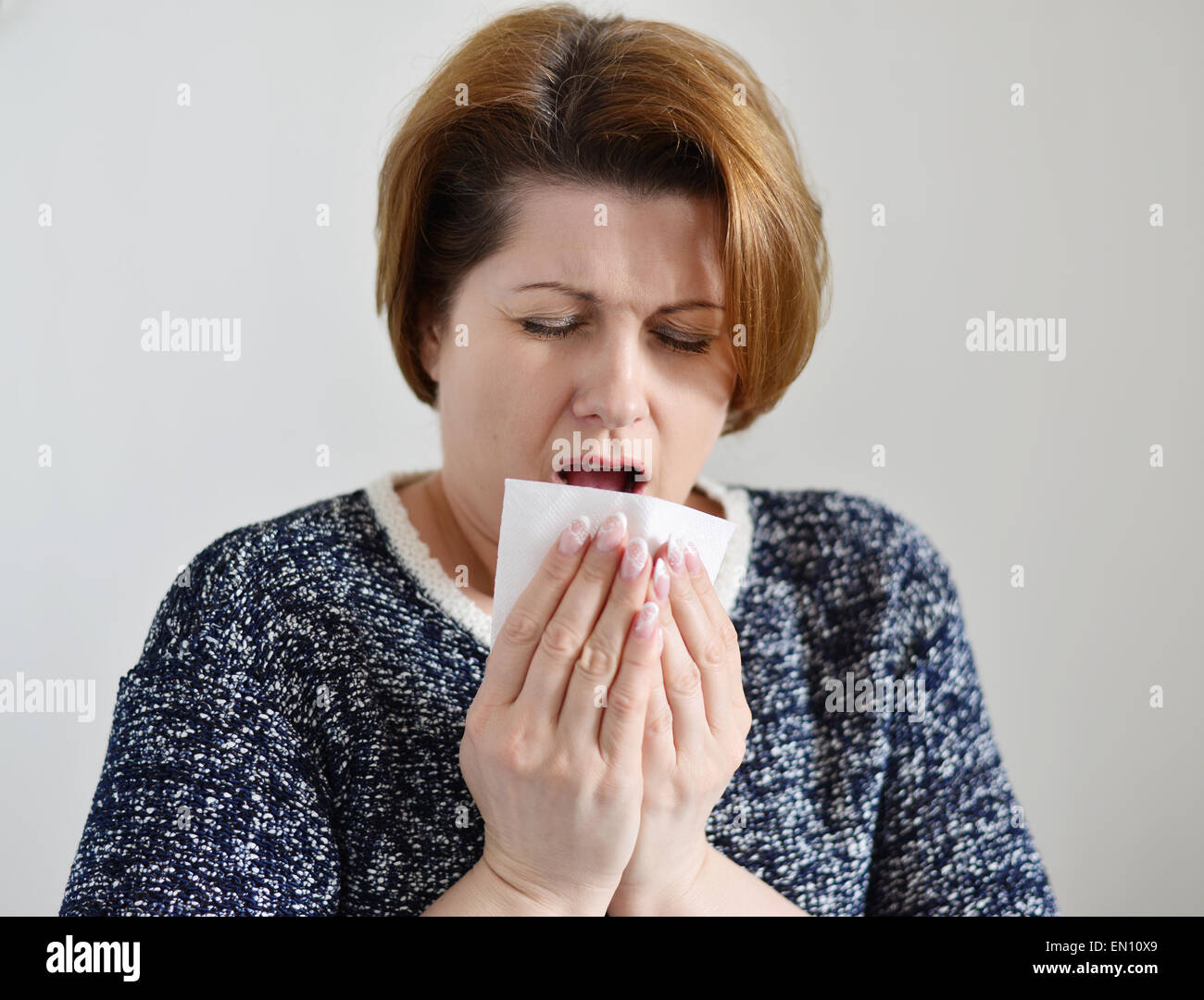 An Adult woman with a runny nose Stock Photo - Alamy