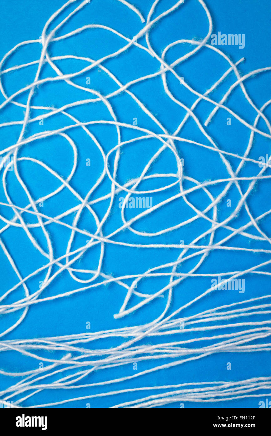 Abstract white wool strings on blue background Stock Photo - Alamy