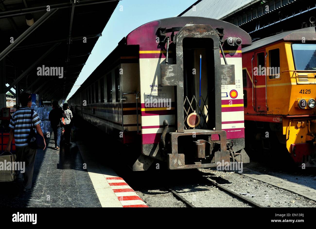 Bangkok, Thailand: Passengers on platform boarding a Thai Railways ...