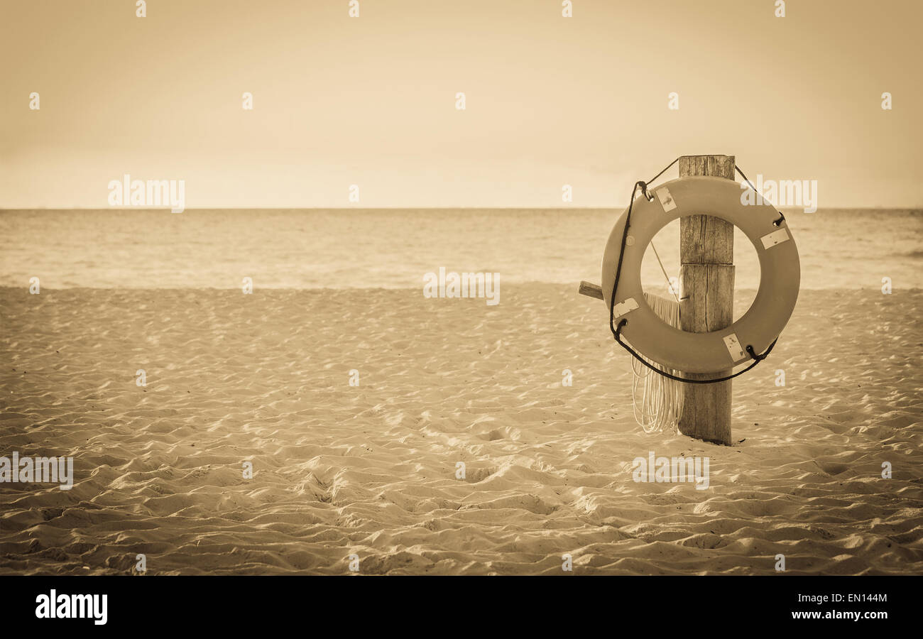 Life preserver on sandy beach somewhere in Mexico Stock Photo - Alamy