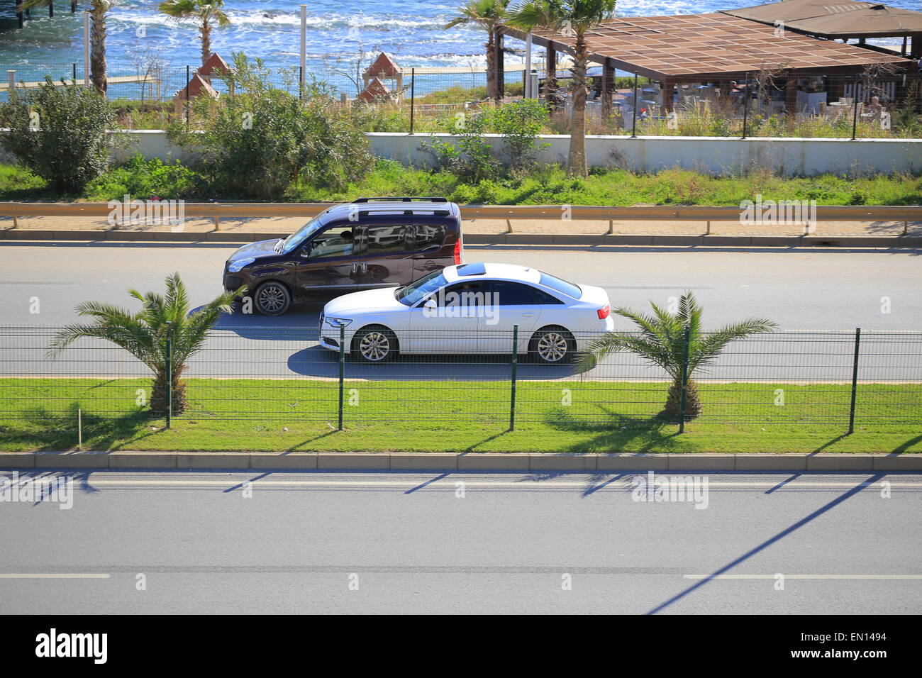 Two cars traveling on the road Stock Photo - Alamy