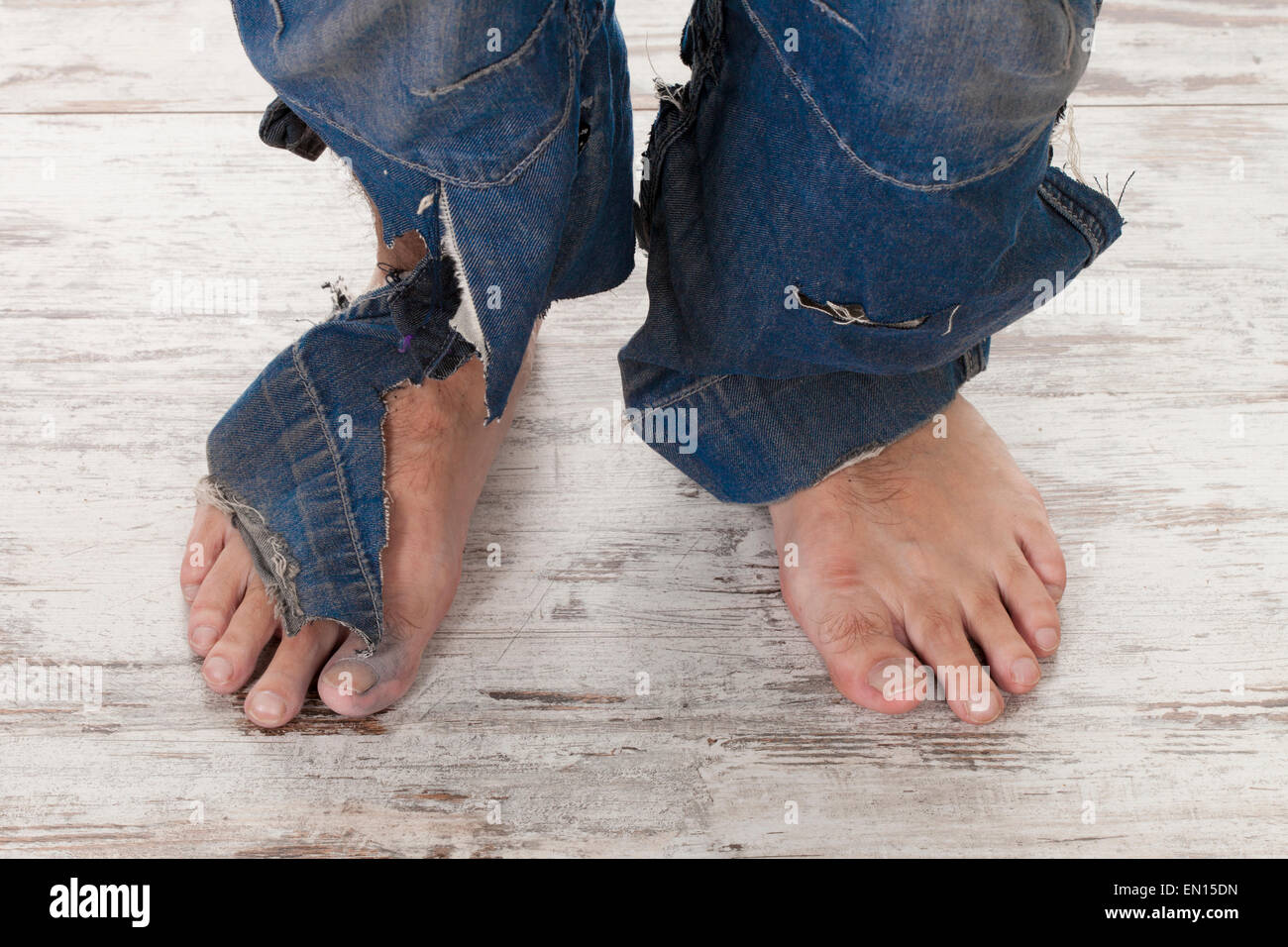 concept of a poor person and his feets Stock Photo - Alamy