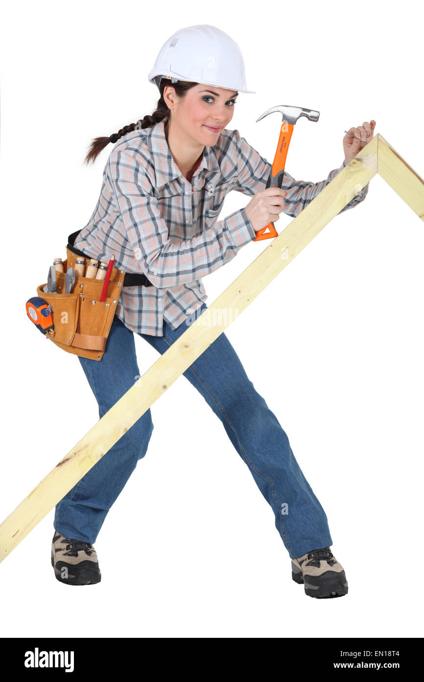 Lady carpenter with hammer Cut Out Stock Images & Pictures - Alamy
