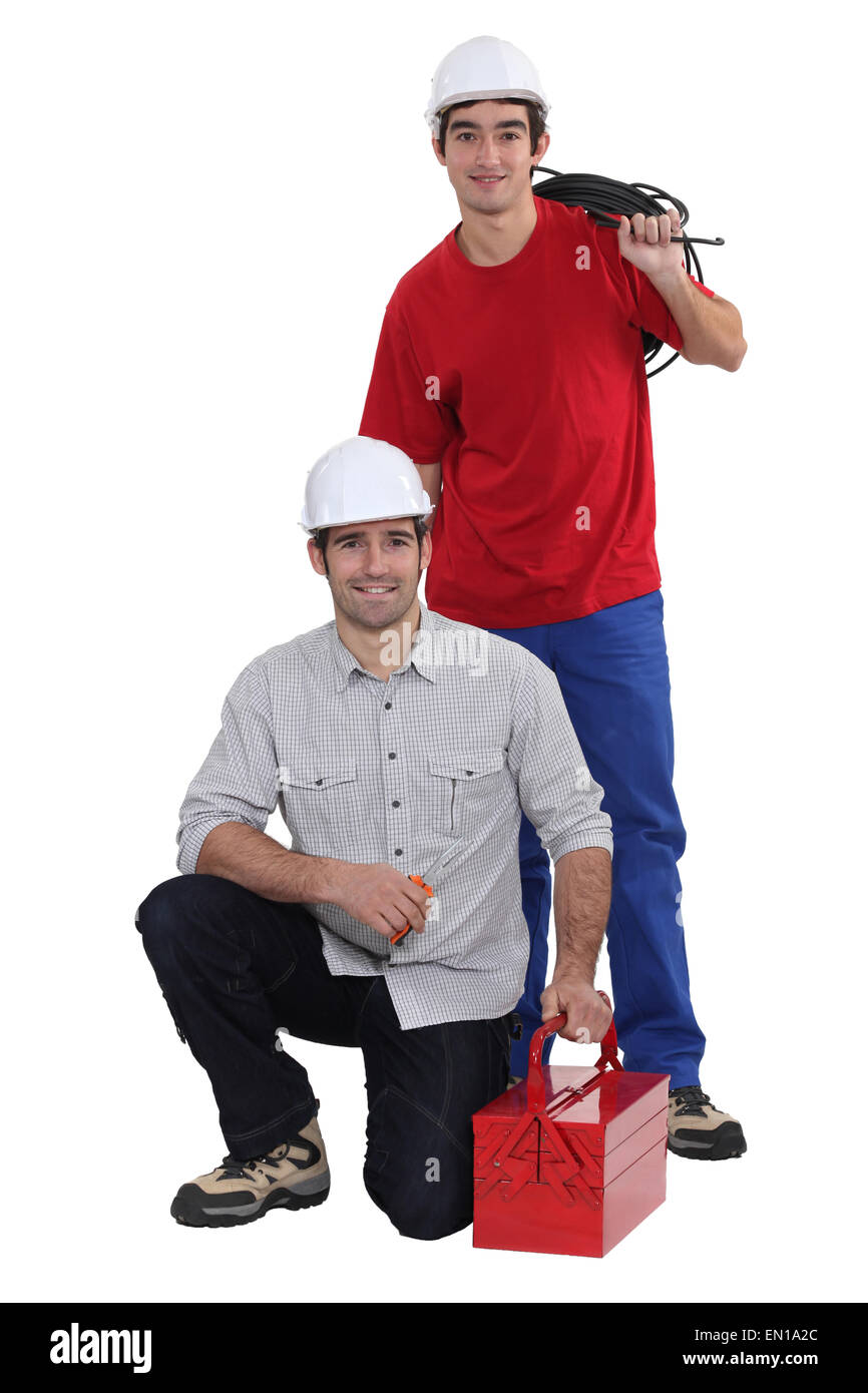 Plumber and electrician working as team Stock Photo - Alamy