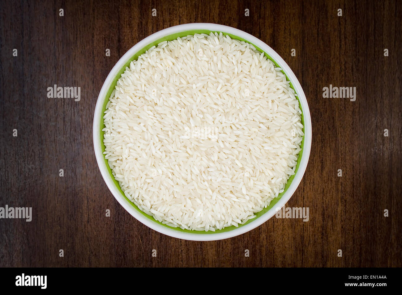 Raw rice in a bowl Stock Photo - Alamy