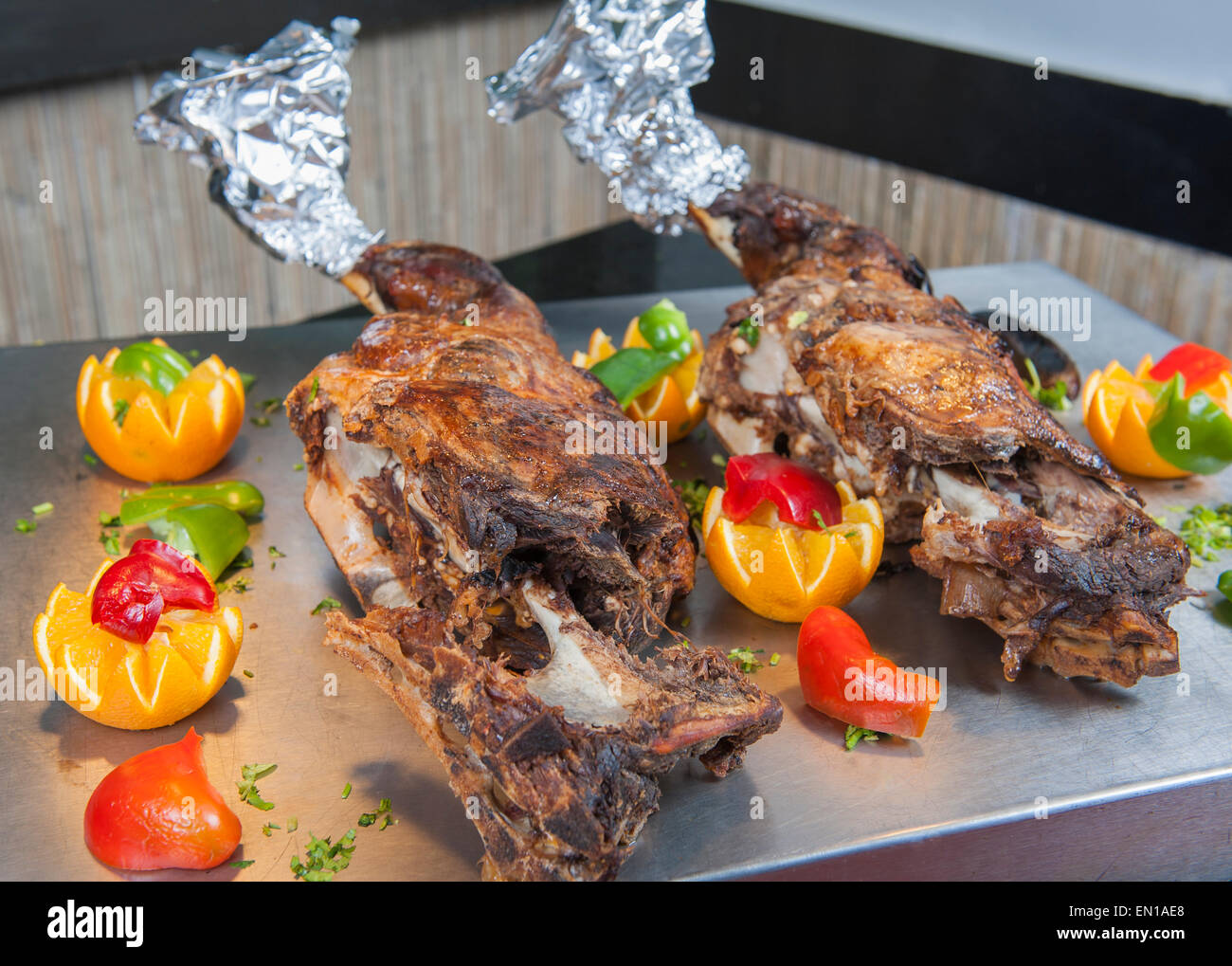 Closeup showing leg of lamb on display at a hotel restaurant buffet ...