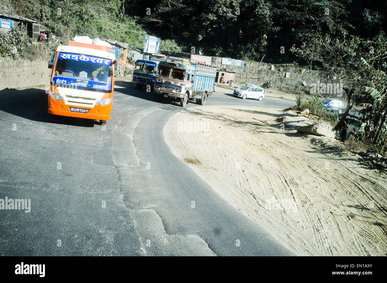 Colorful Bus on a Winding Road in Rural Nepal Stock Photo - Alamy