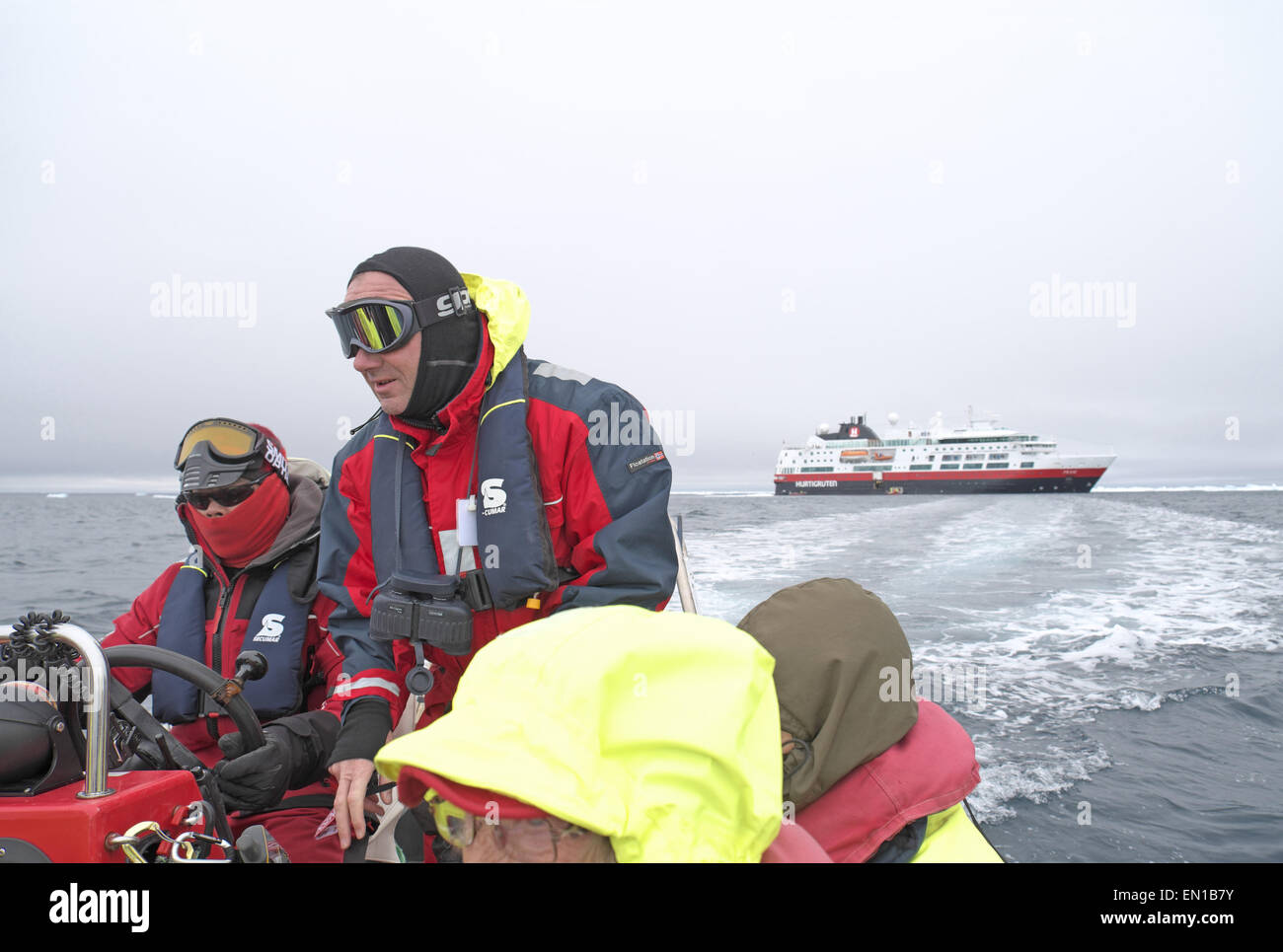 Tourists & crew in one of MV Fram's Zodiac boats at edge of North Pole ...