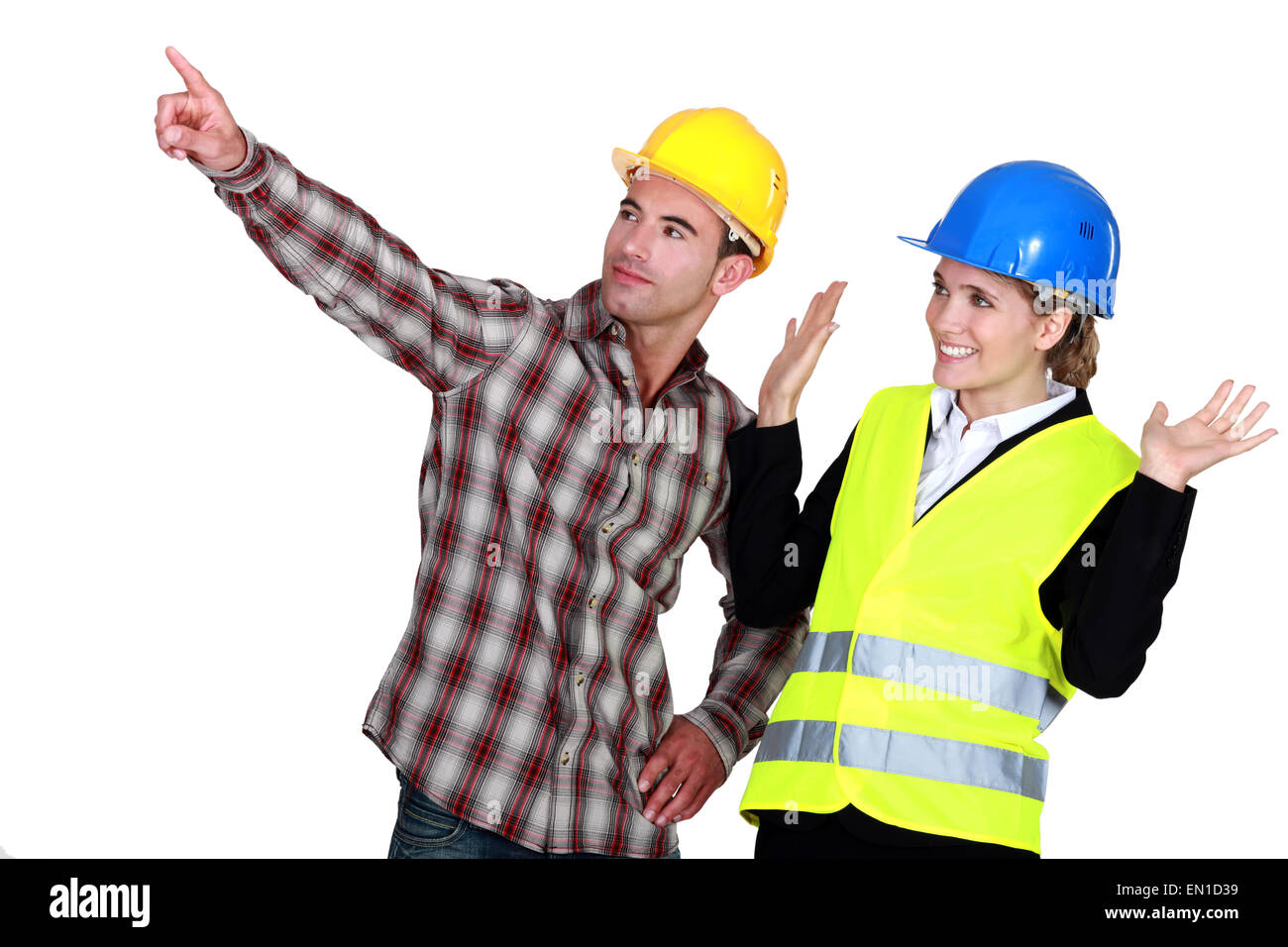 Construction worker pointing out a problem while his co-worker denies ...