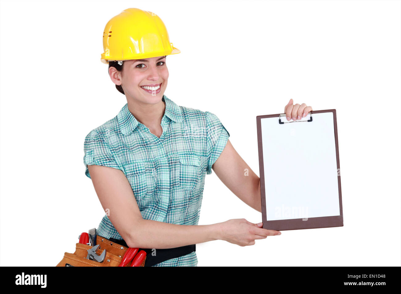 Woman pointing to clip-board Stock Photo - Alamy
