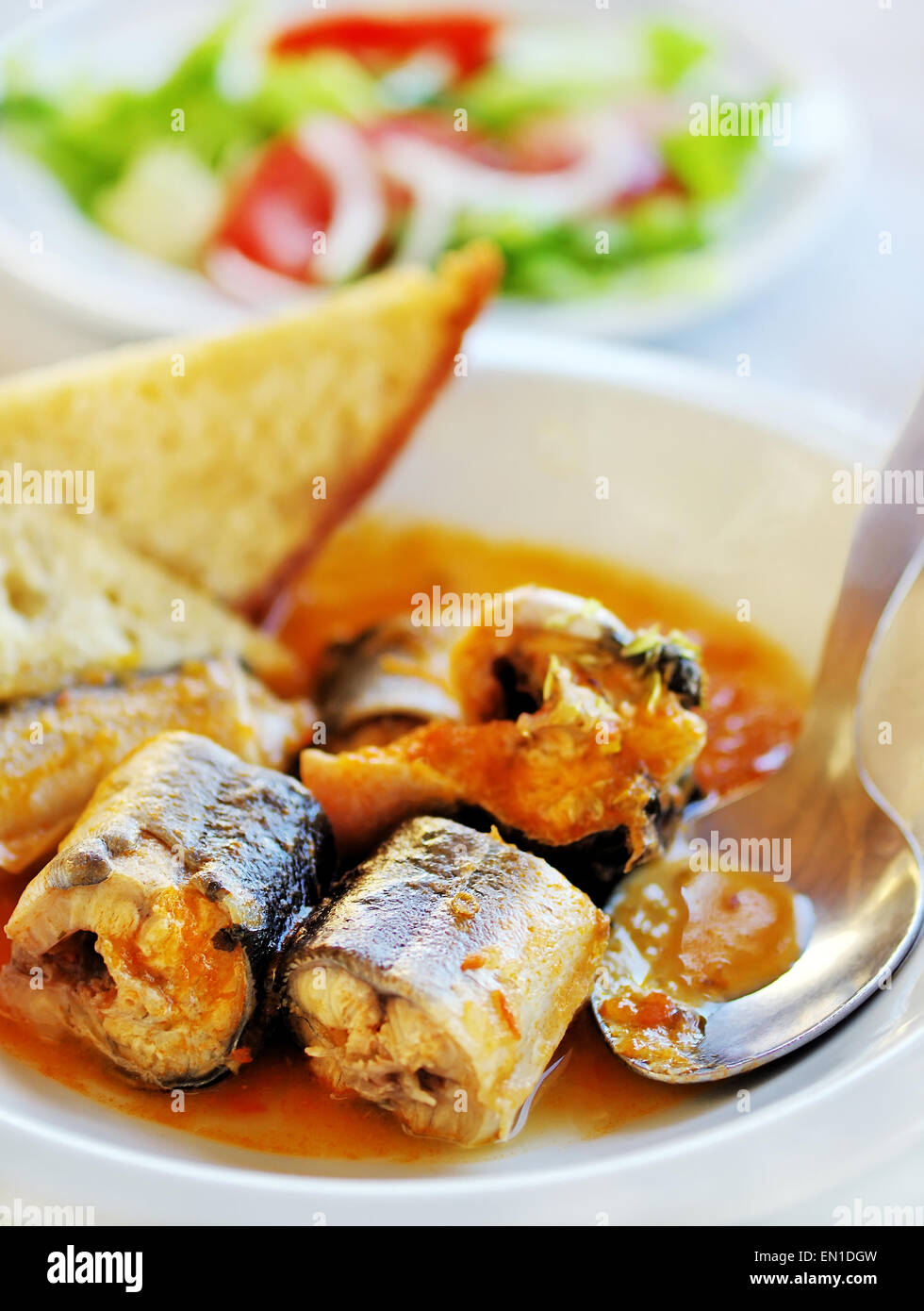 eel stew with tomato and toasted bread Stock Photo - Alamy