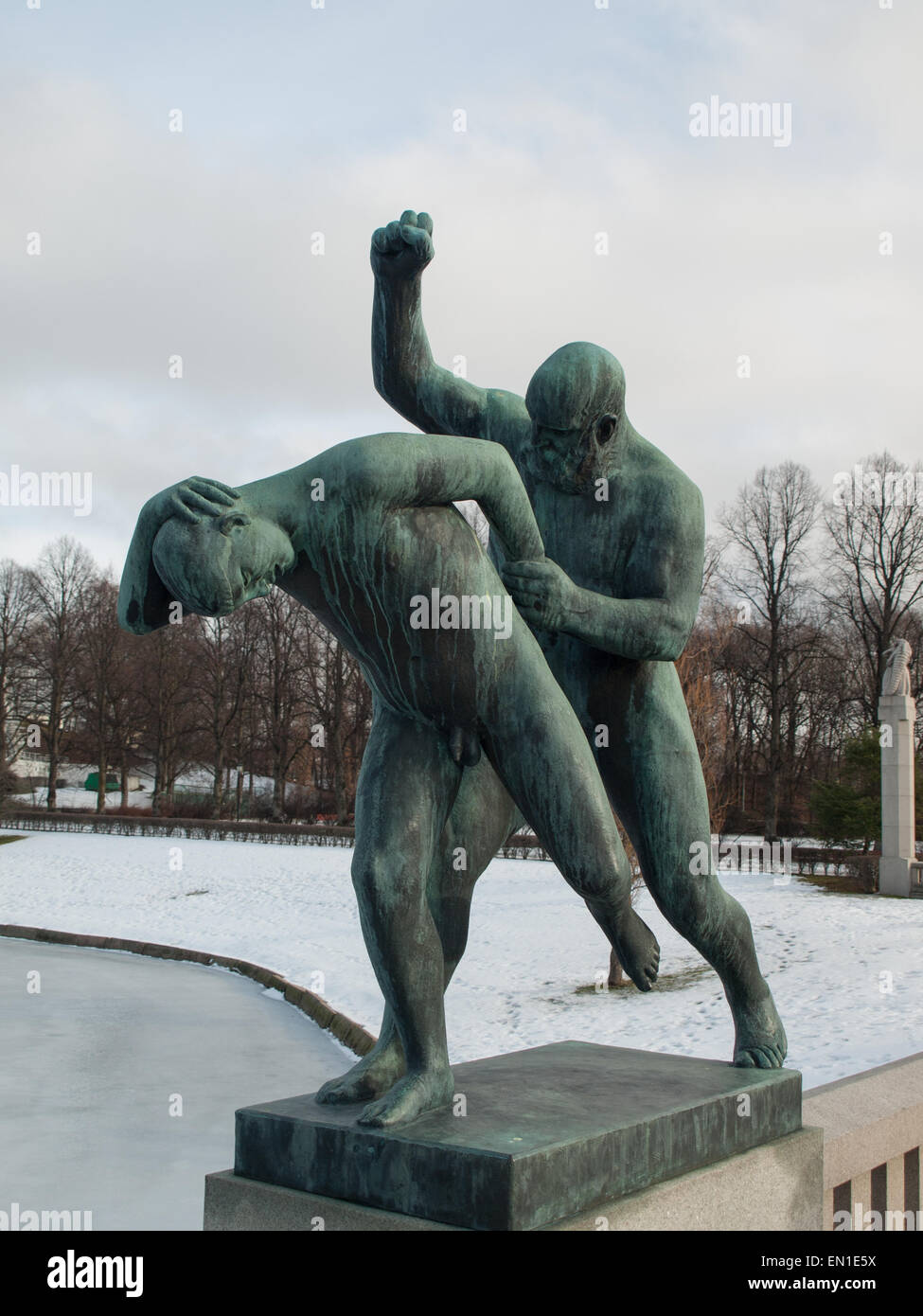Vigeland's statue of an old man grabbing a younger man's hand and ...