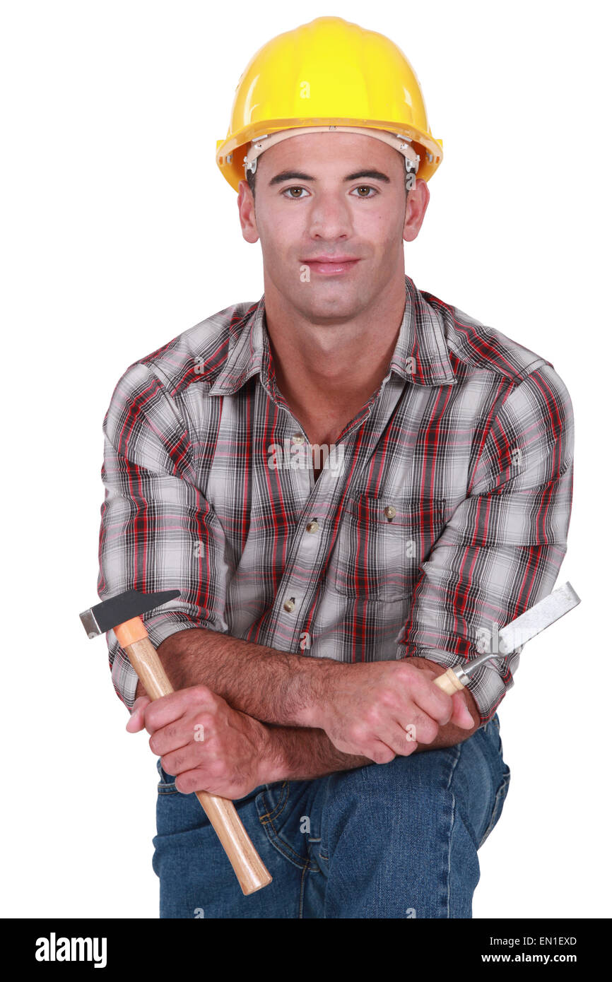 Carpenter stood with hammer and chisel Stock Photo - Alamy
