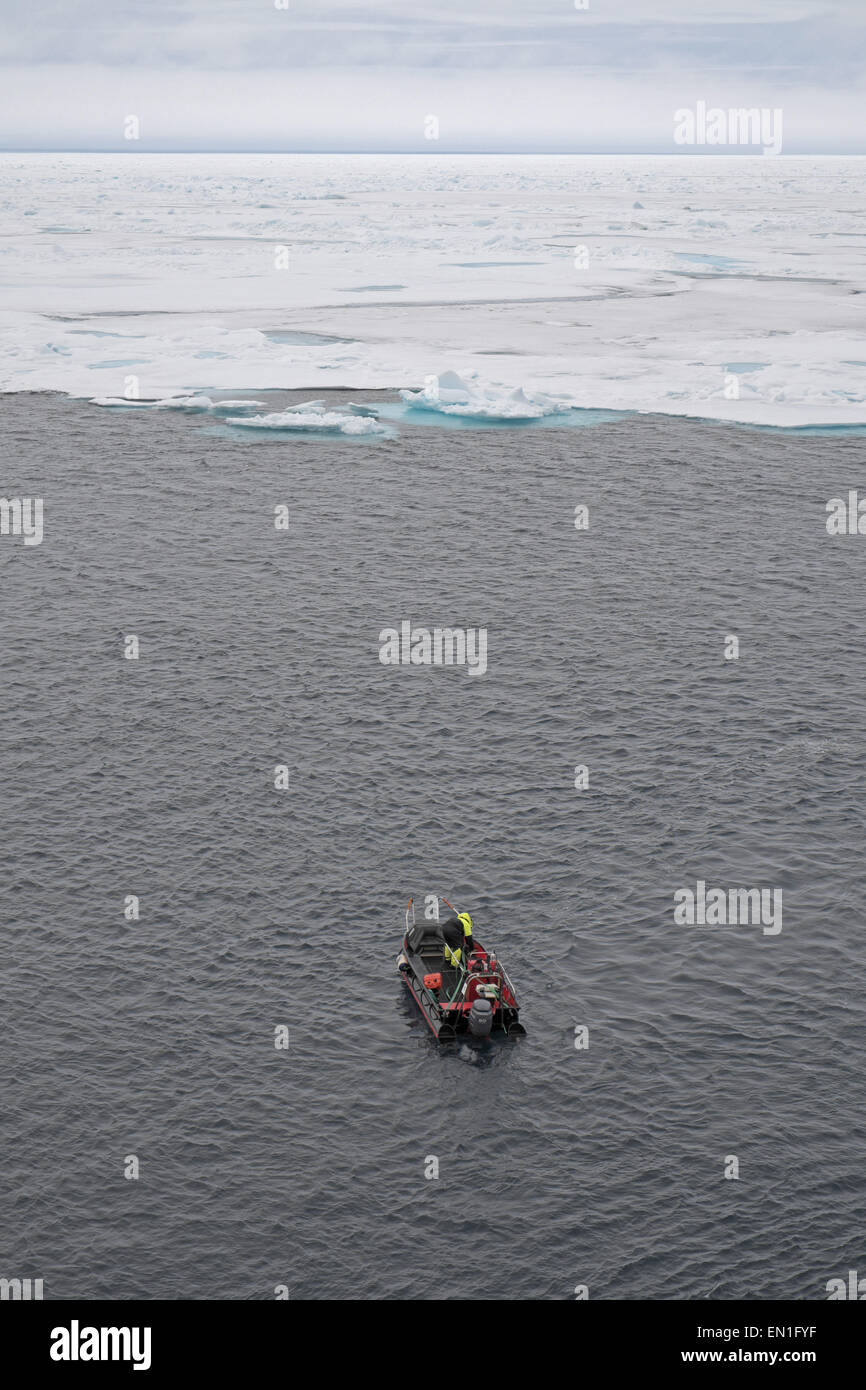 Solitary Zodiac boat at edge of North Polar ice sheet seen from MV Fram ...