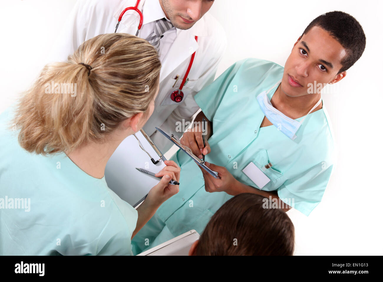 4 people talking hospital hi-res stock photography and images - Alamy