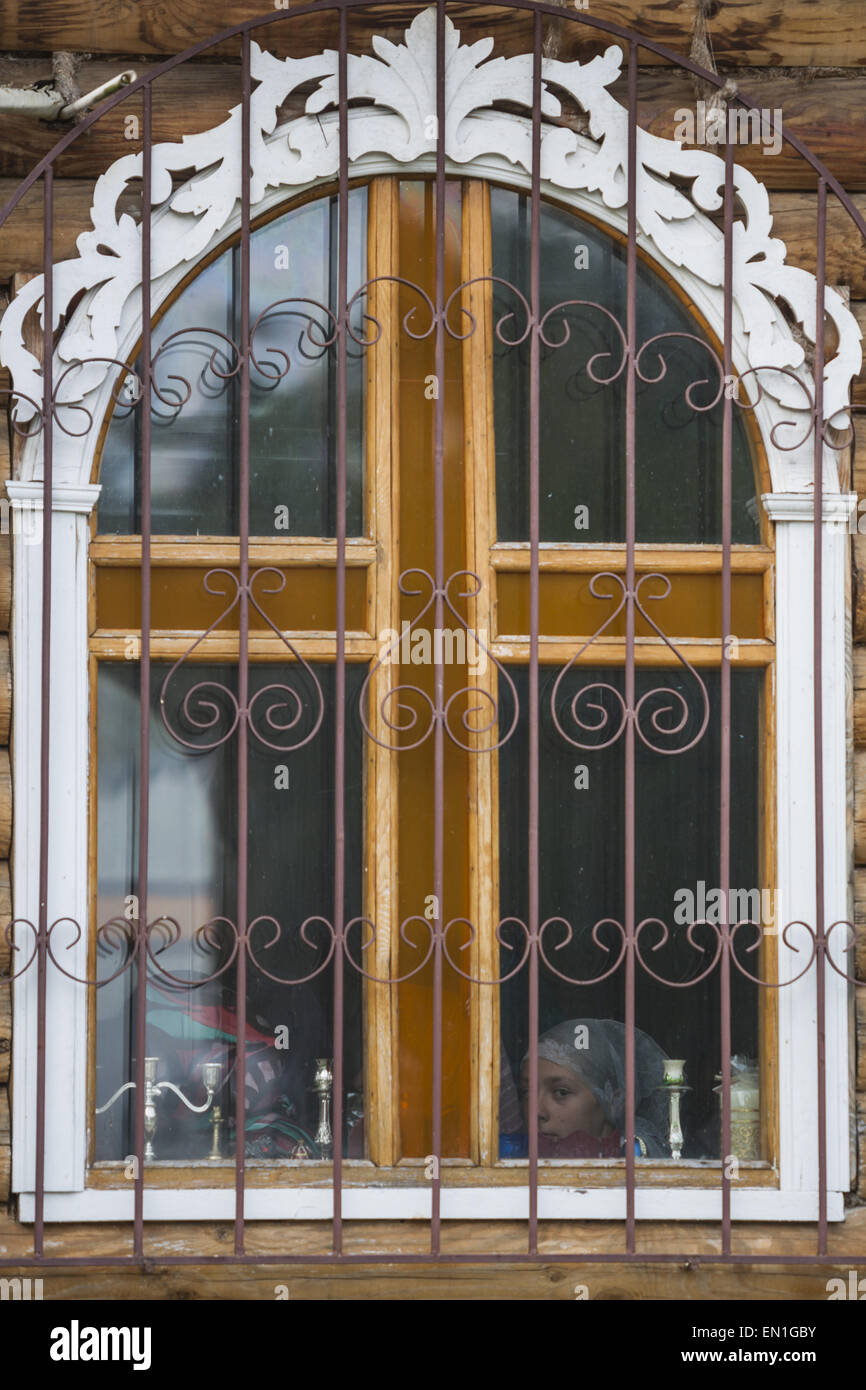 Slavutych, Ukraine. 30th Aug, 2014. Girl looking through a window of ...