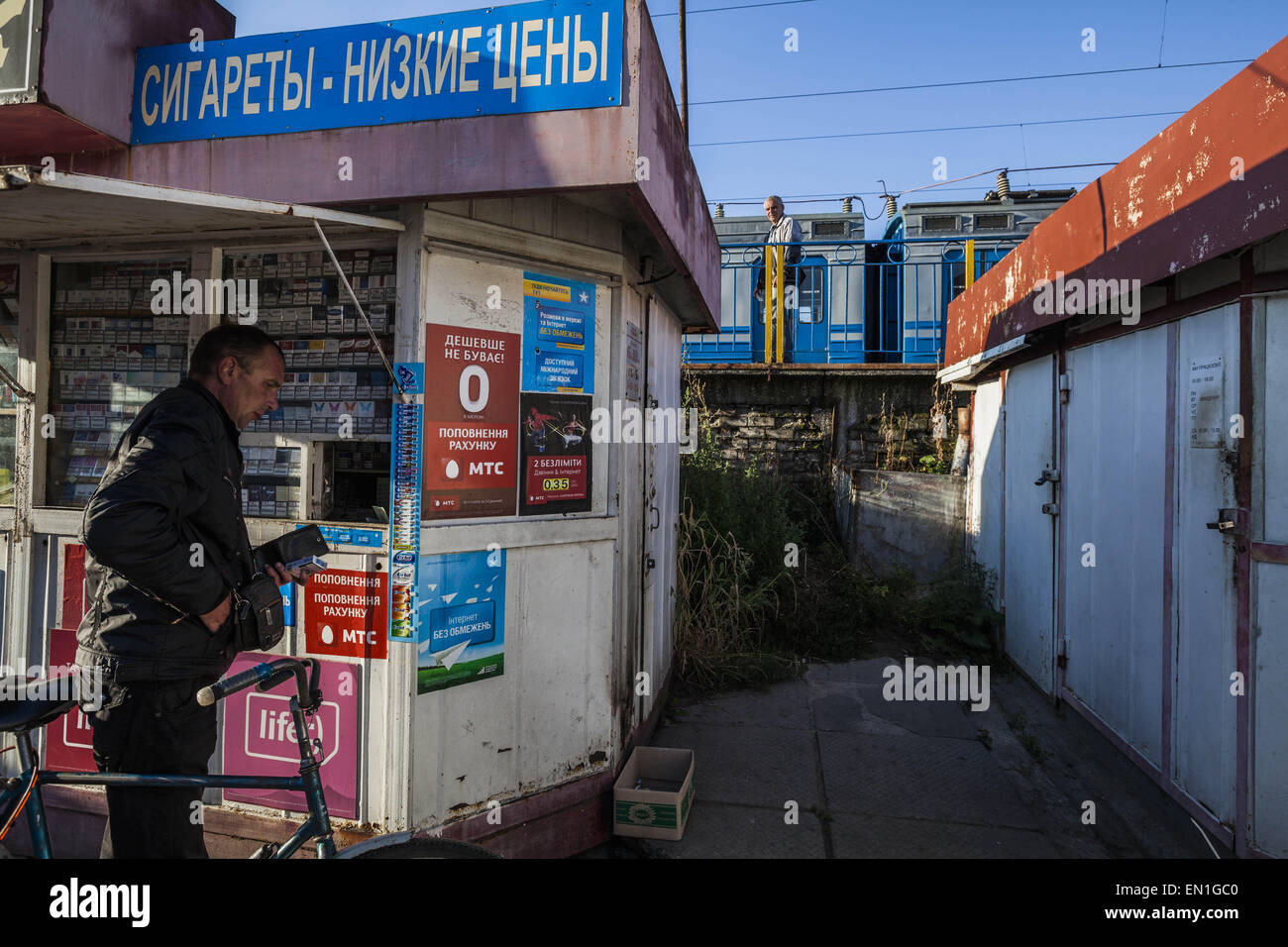 Slavutych, Ukraine. 29th Aug, 2014. A man buys cigarettes before taking ...
