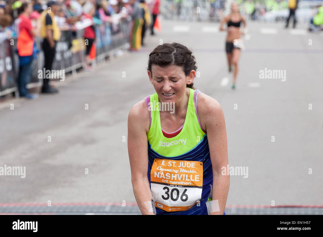 Here she crosses the finish line hi-res stock photography and images ...