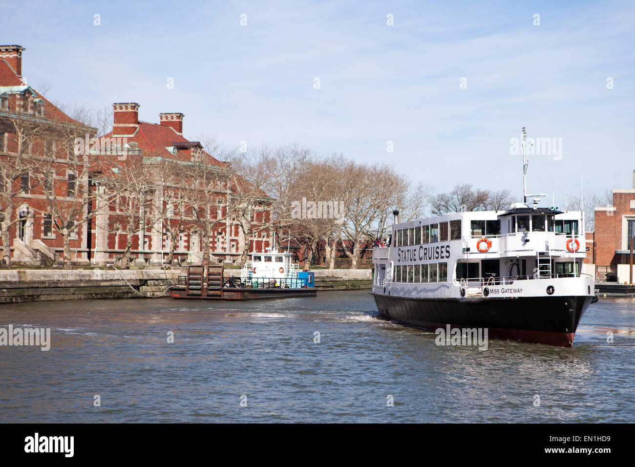 Statue cruises tour boat at Ellis Island National Museum of Immigration ...