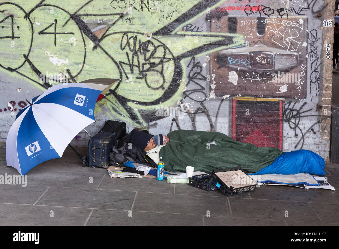 Homeless couple sleeping rough under London Bridge, London, England ...