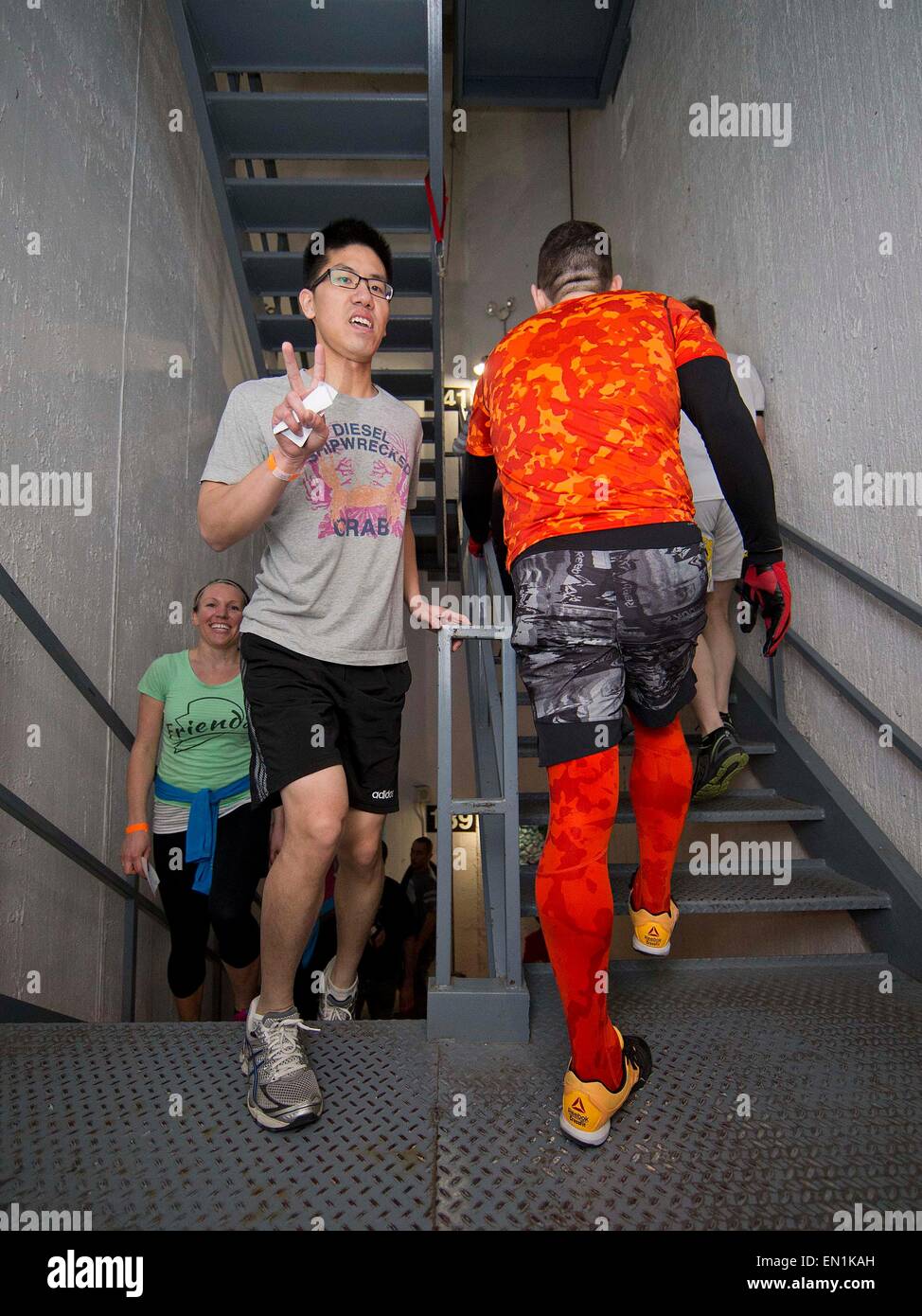 Toronto, Canada. 25th Apr, 2015. Participants climb the stairs during ...