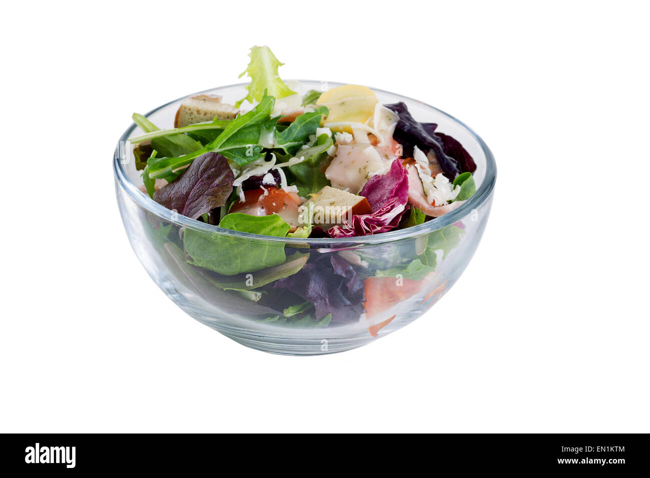 Close up front view of a fresh salad in glass bowl isolated on white ...