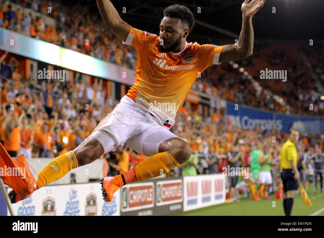APR 25 2015: Houston Dynamo forward Giles Barnes #10 kicks the corner ...