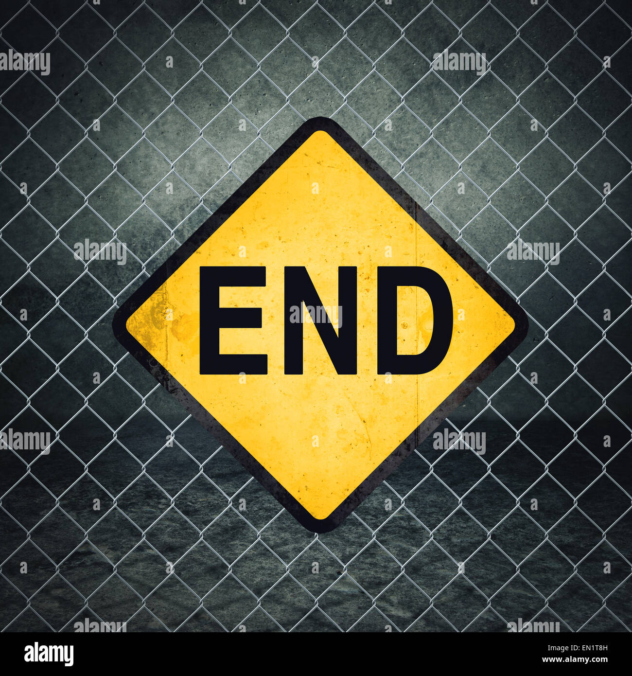 End Grunge Yellow Warning Sign on Chain link Fence of Industrial ...