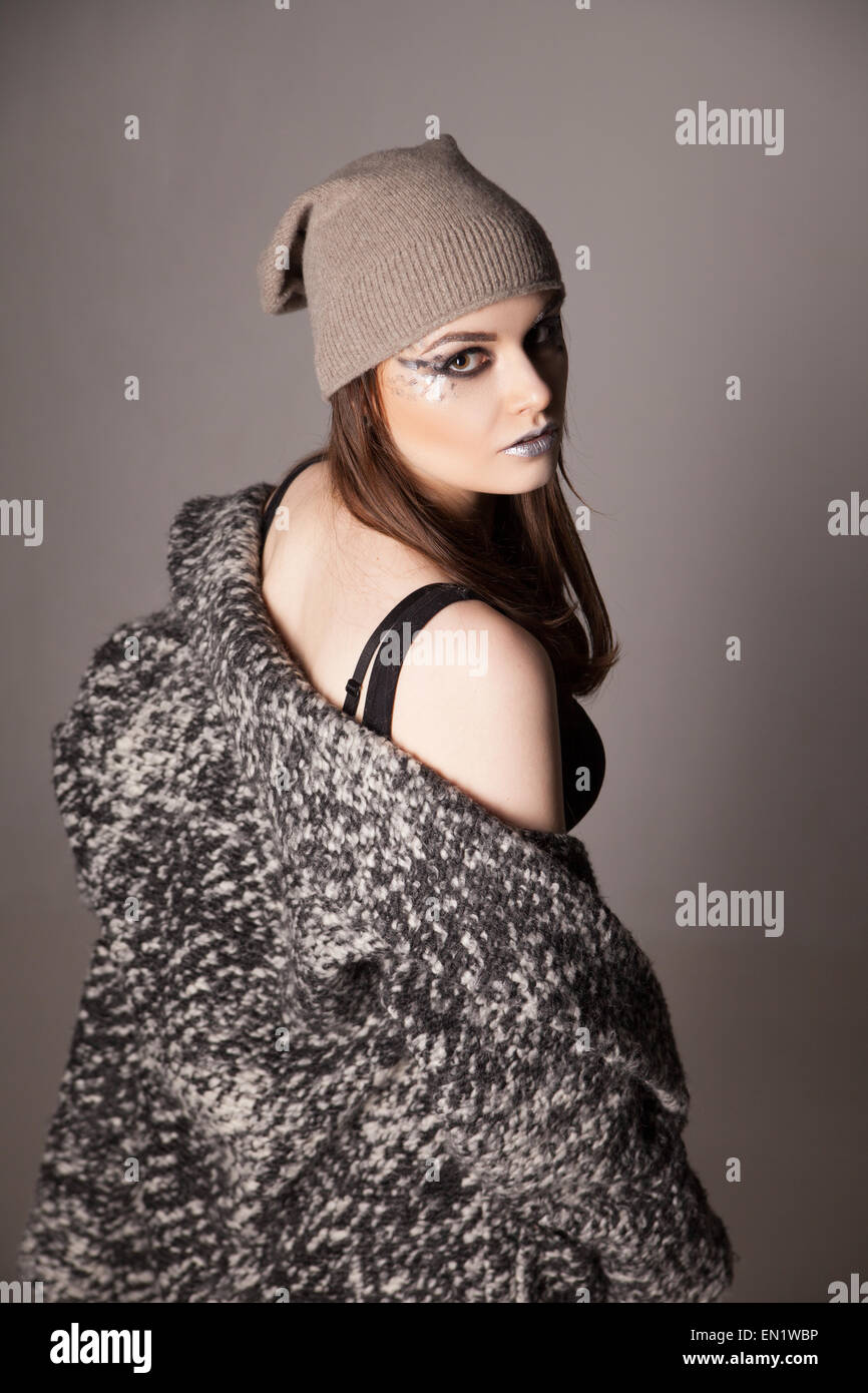 young woman turned and looking over her shoulder . Woman portrait ...