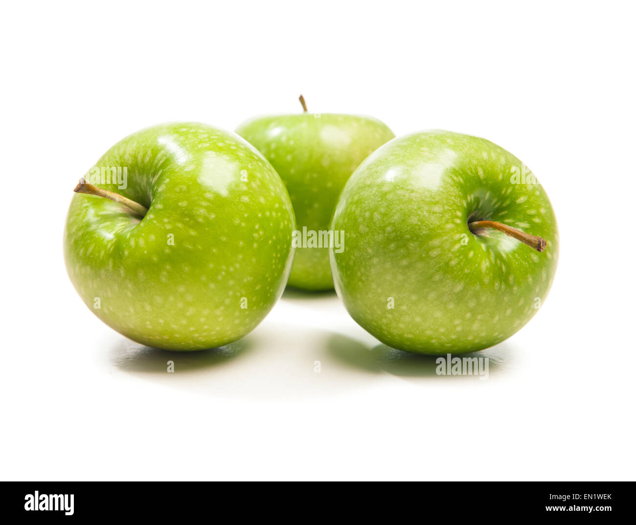 Three green apple, isolated on white background Stock Photo - Alamy