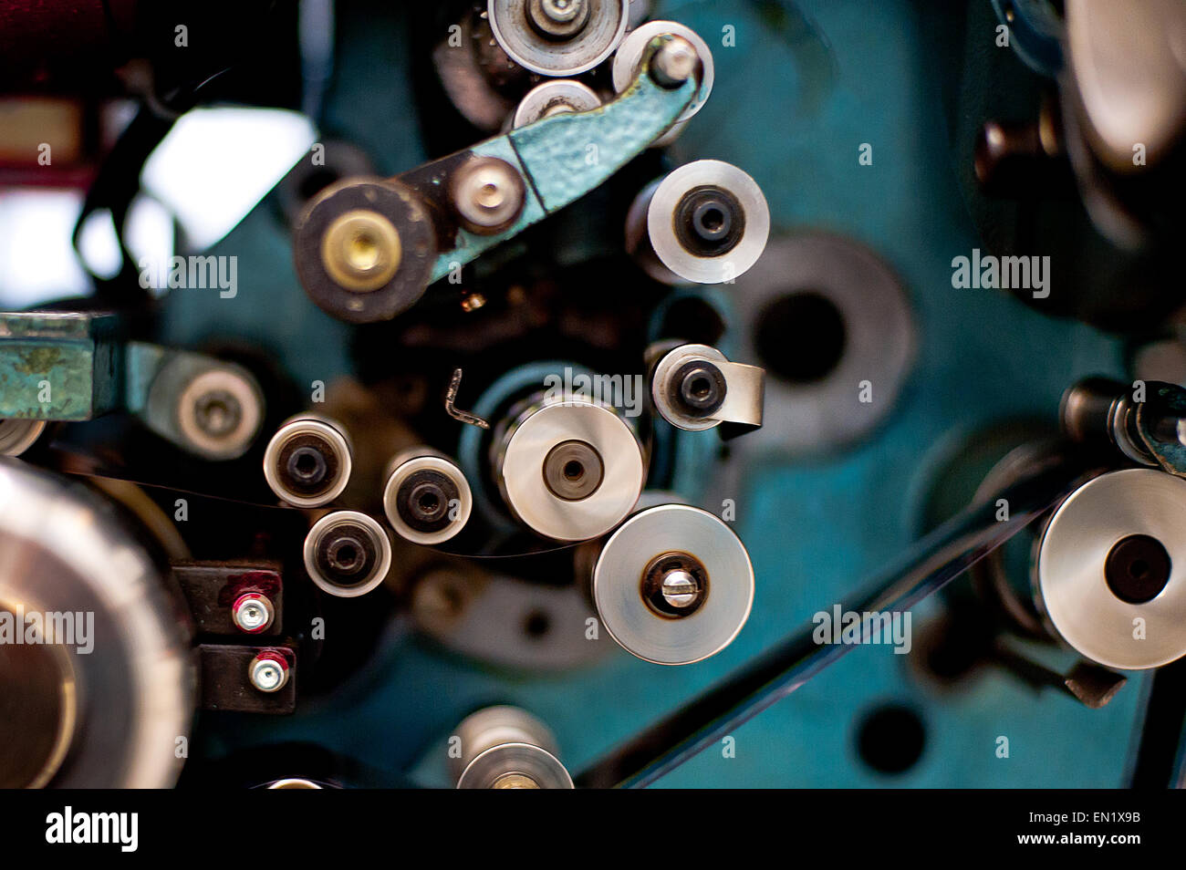 35 mm movie cinema projector detail with spool and film running, detail ...