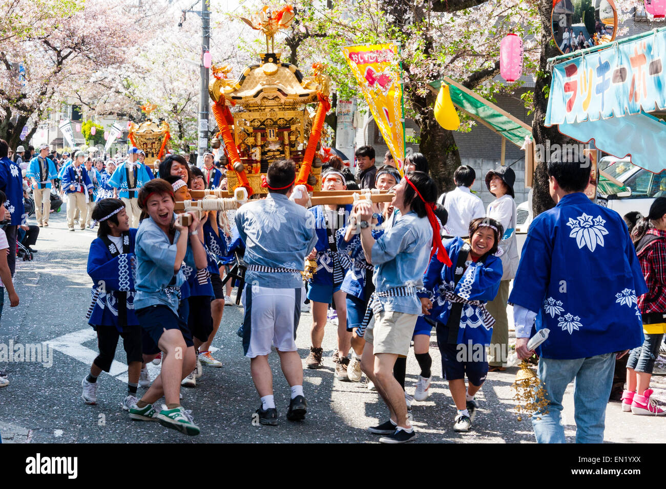 The yearly Genji parade in Tada, Japan. Team of men lifting and ...