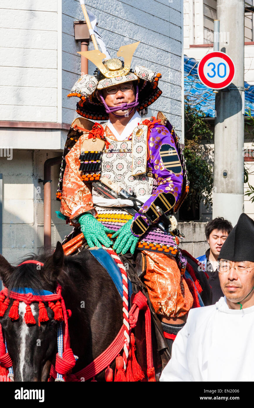 Japanese man dressed in full samurai armour and Kabuto helmet, on ...
