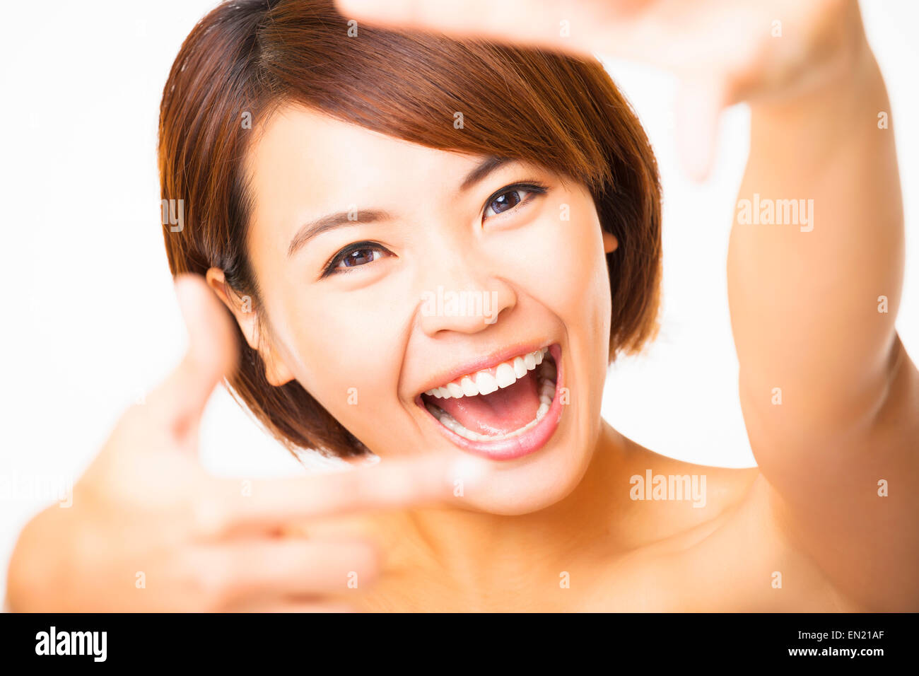 happy young Woman showing frame finger sign Stock Photo - Alamy
