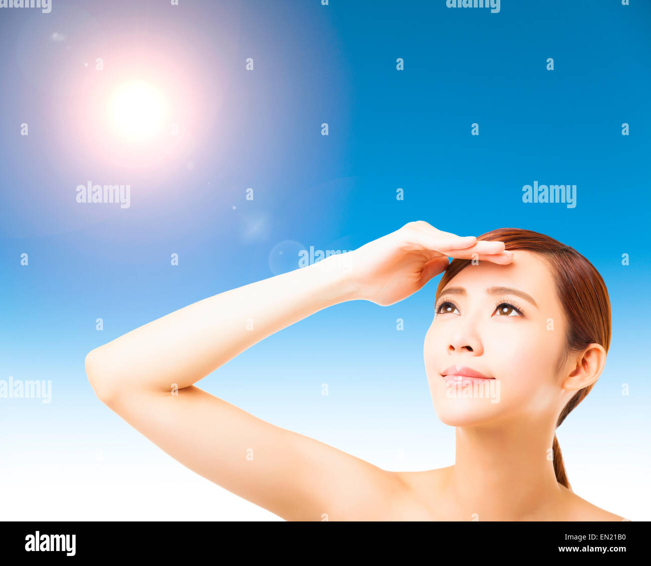 young woman face with sunlight background Stock Photo - Alamy