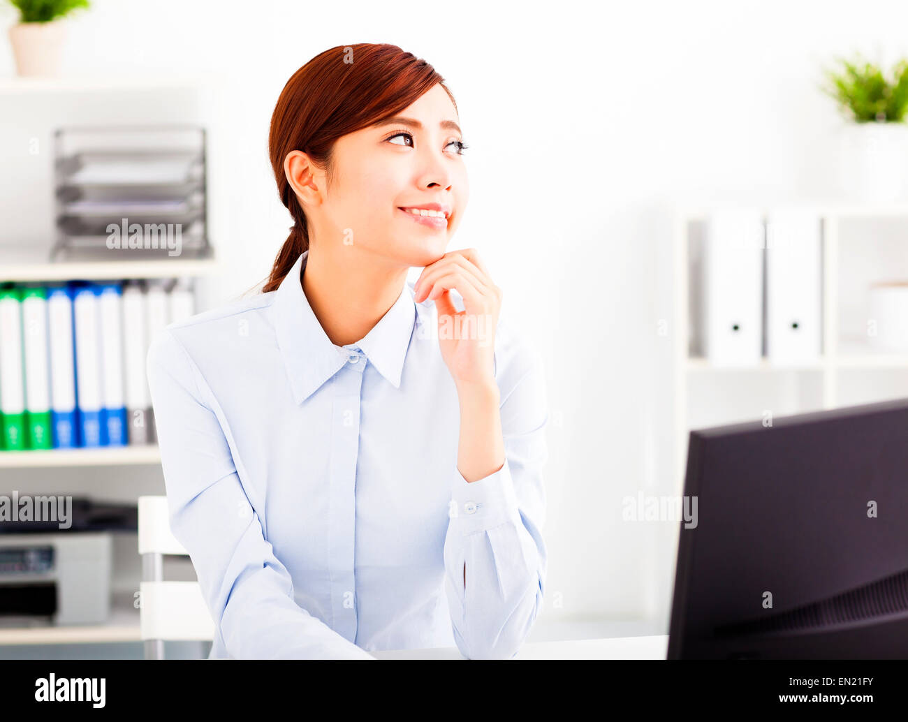 young business woman thinking in the office Stock Photo - Alamy