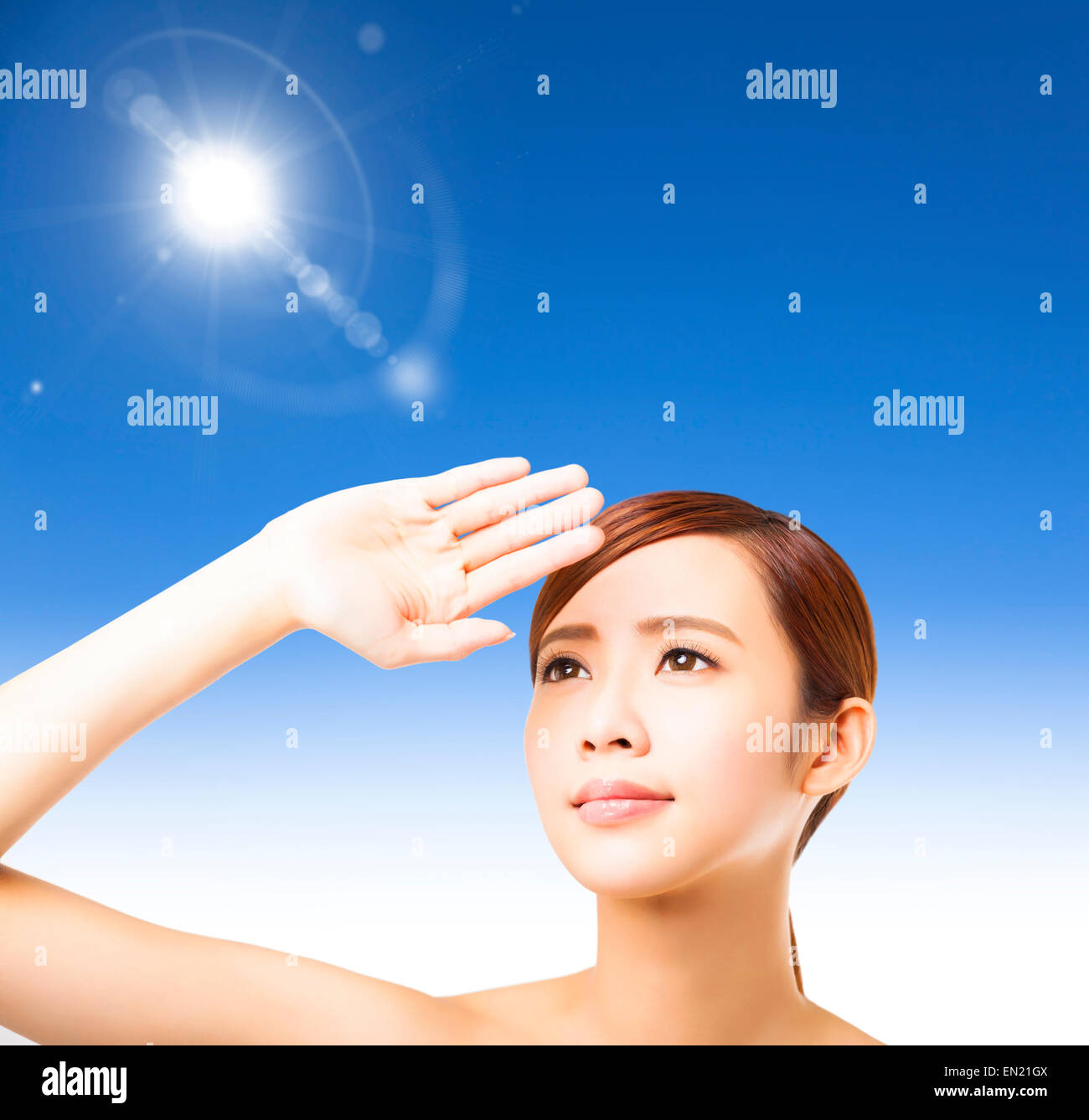 young woman face with sunlight background Stock Photo - Alamy