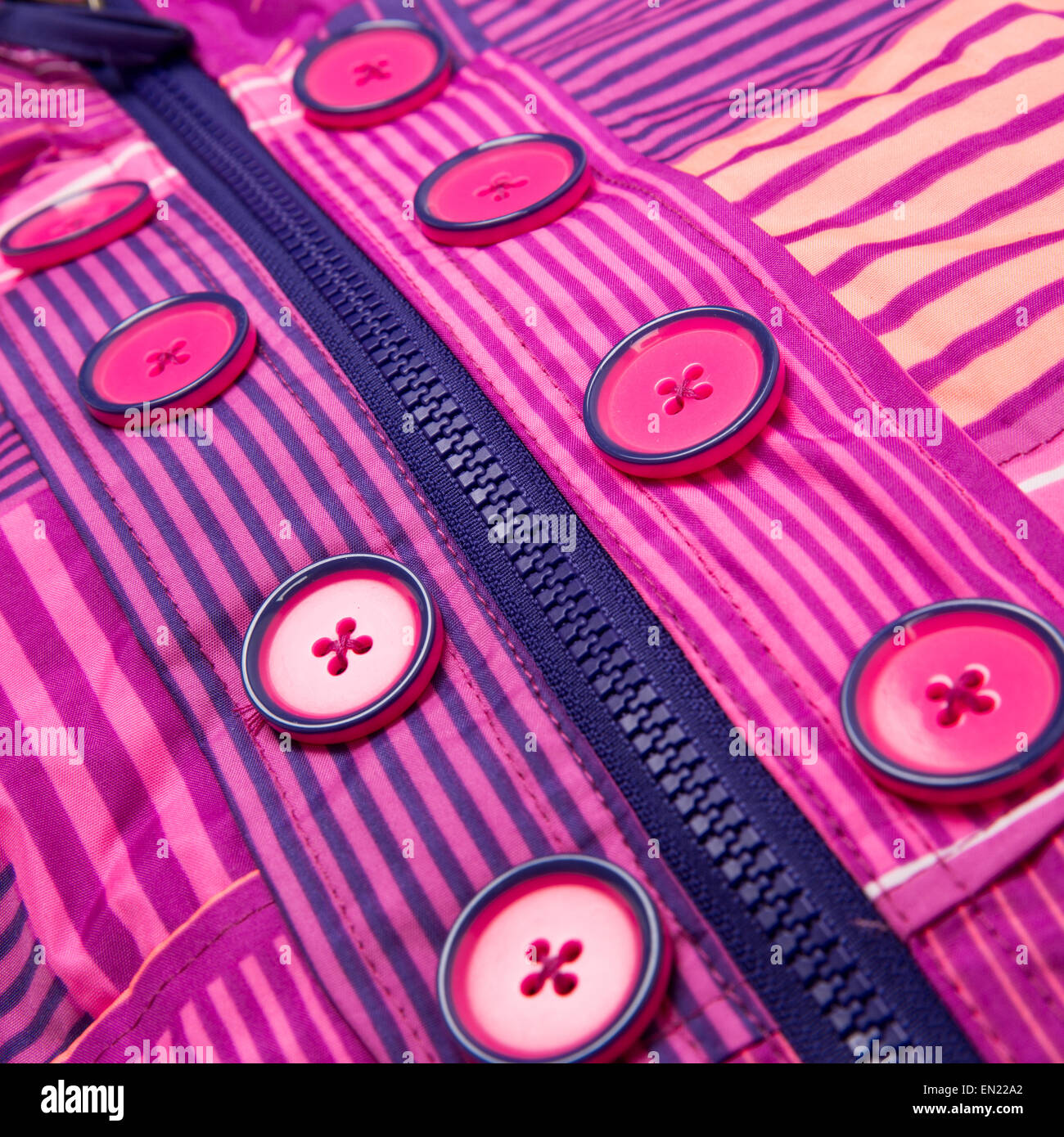 Close up zipper and button on a colorful background Stock Photo - Alamy