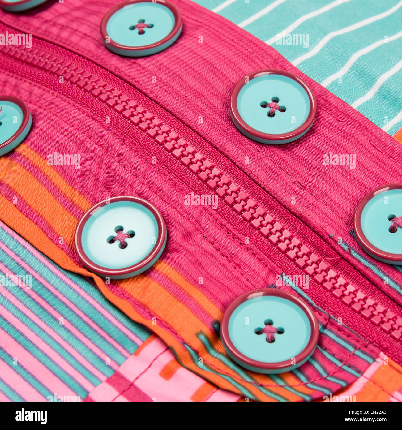 Close up zipper and button on a colorful background Stock Photo - Alamy