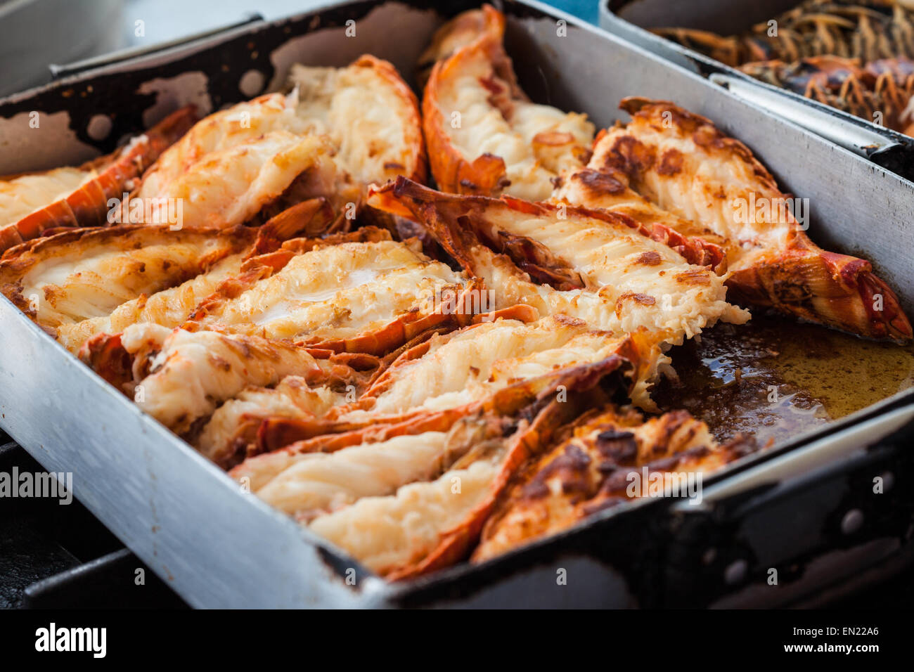 Fried lobsters in a pan on a plate Stock Photo - Alamy