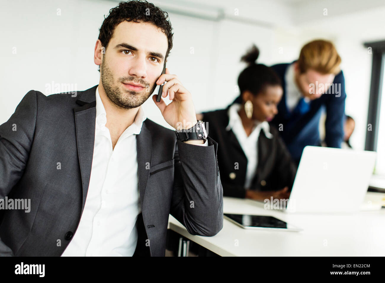 Young man working in the office Stock Photo - Alamy