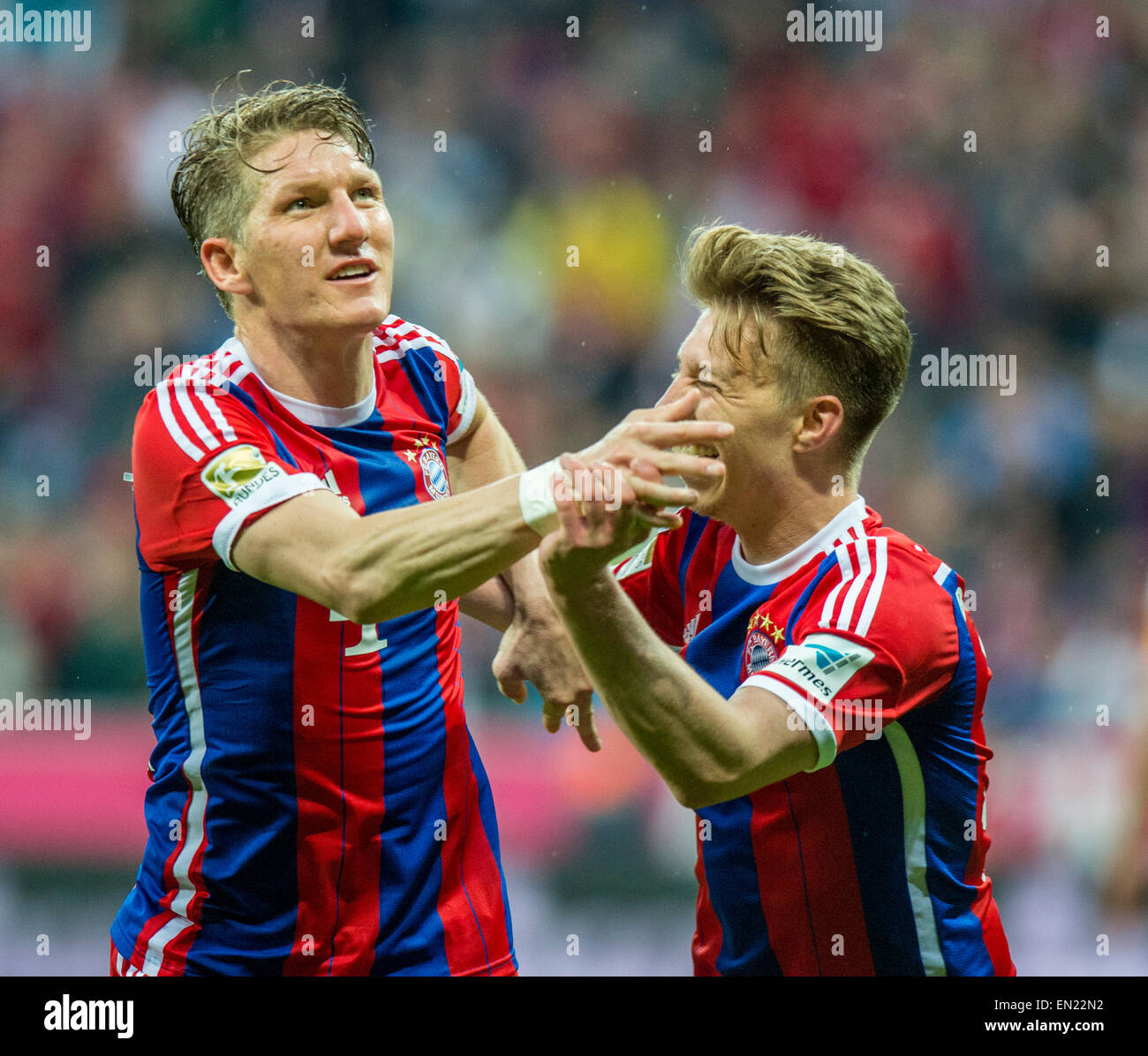 Munich's Bastian Schweinsteiger (L) celebrates his 1-0 goal with ...