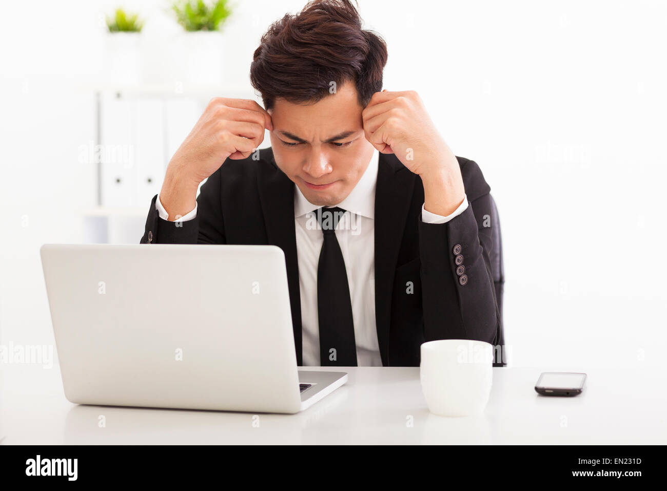 stressed business man in the office Stock Photo - Alamy