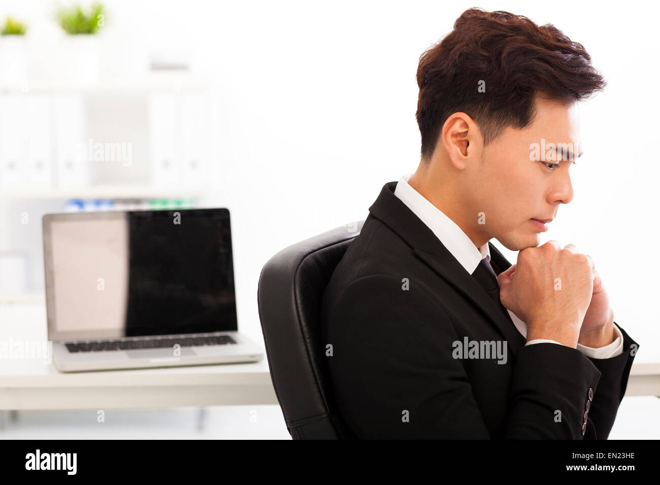 Young business man thinking in the office Stock Photo - Alamy