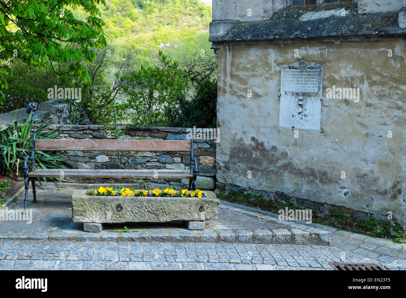 Bench in an old village Stock Photo - Alamy