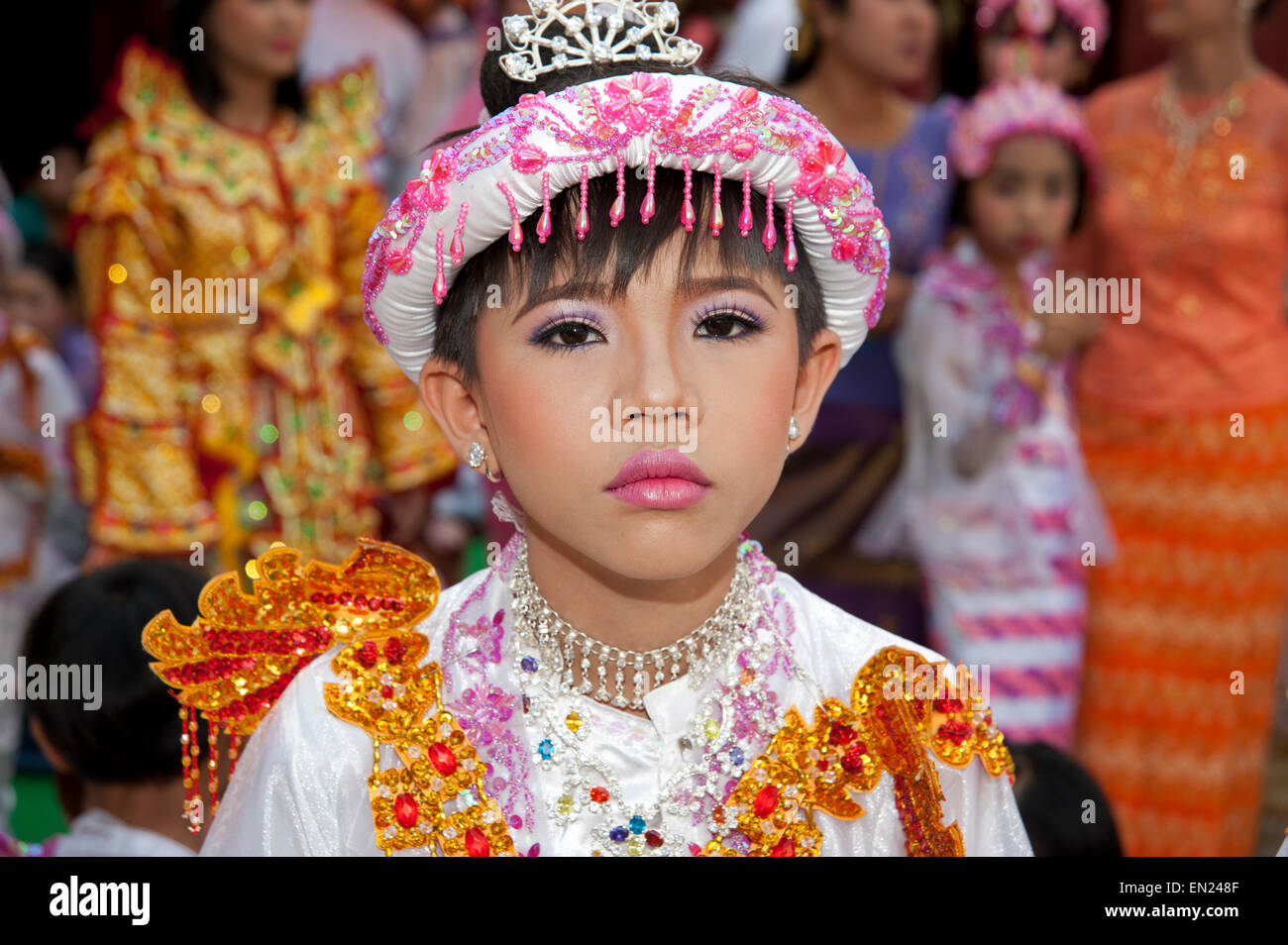 Portrait of a Burmese boy dressed in traditional costume wearing full ...
