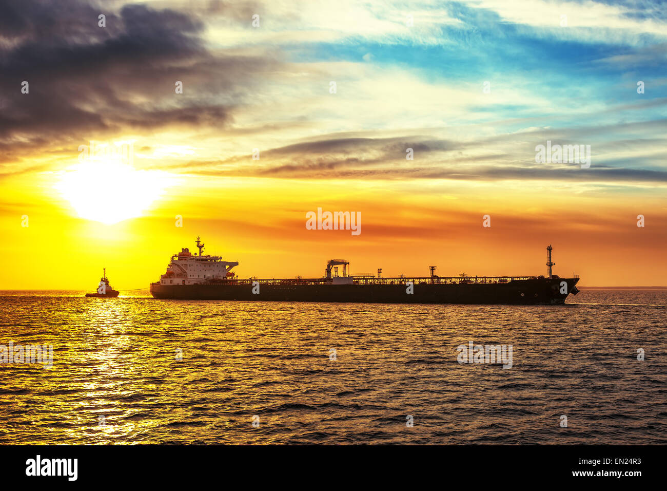 Tugboat pulling the tanker at sea in the morning Stock Photo - Alamy