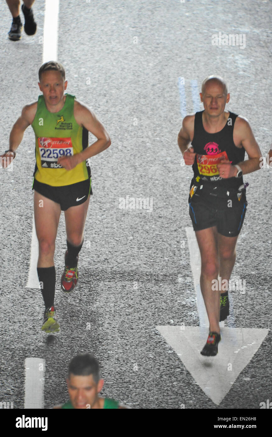 Embankment, London, UK. 26th April 2015. Runners pass along the ...