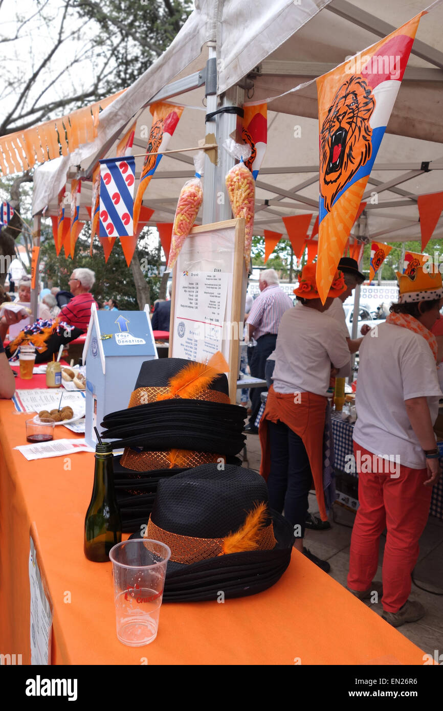 Orange flags and hats at food stand during Dutch King's Day celebrated ...